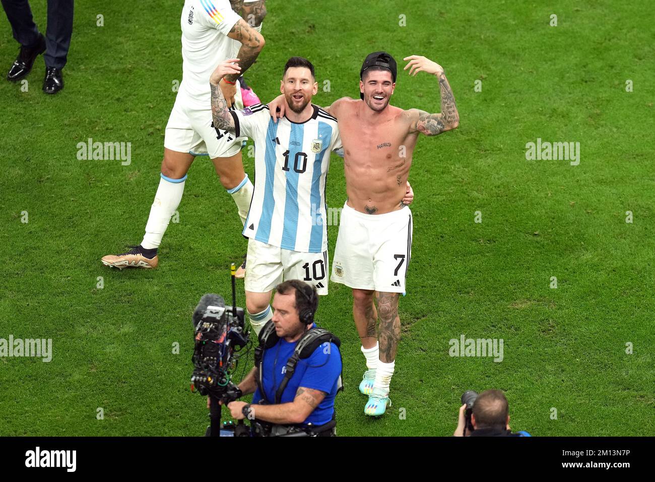 Argentina's Lionel Messi (left) and Rodrigo Paul De celebrate victory ...