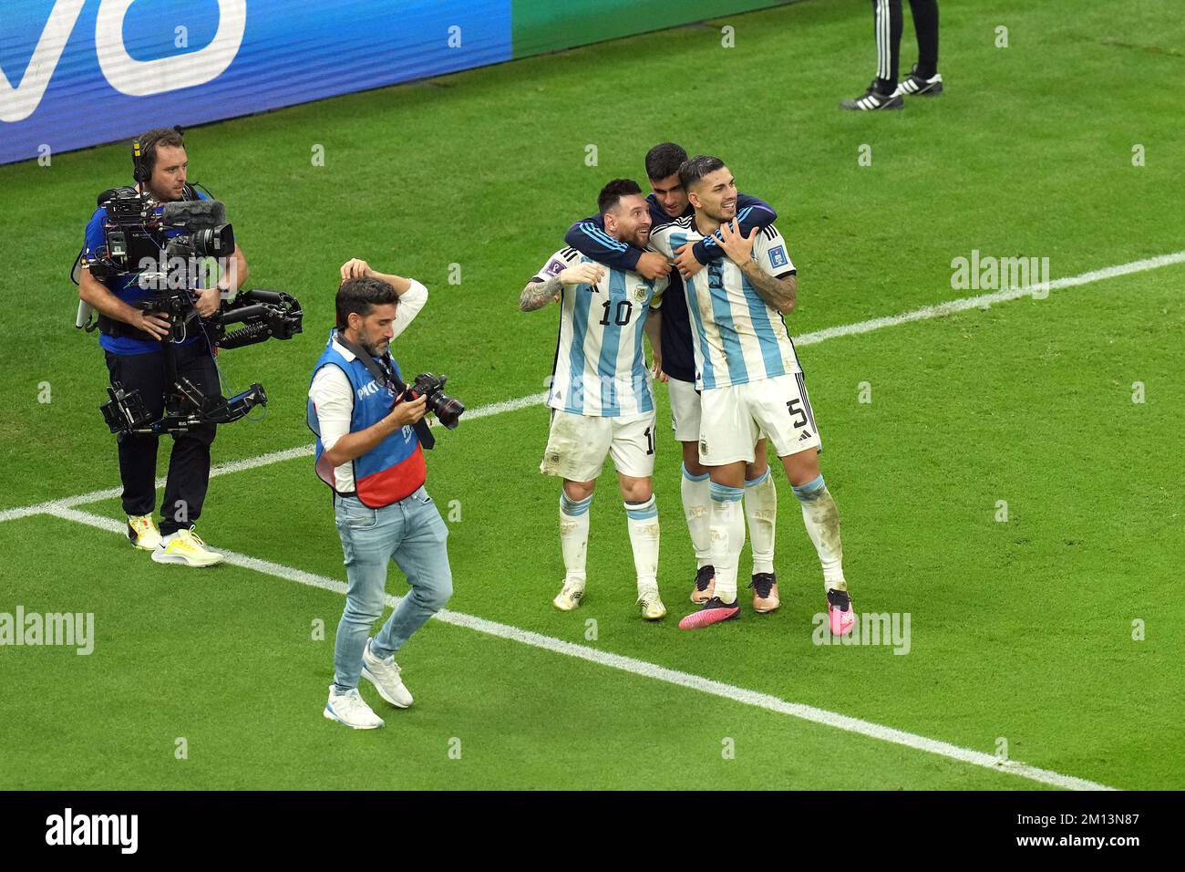 Argentina's Lionel Messi (left) and team-mates celebrate victory in the ...