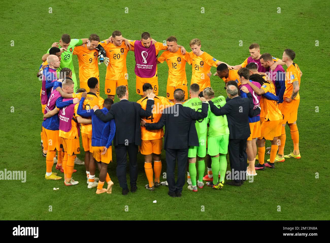 The Netherlands team huddle up after defeat in the penalty shootout ...