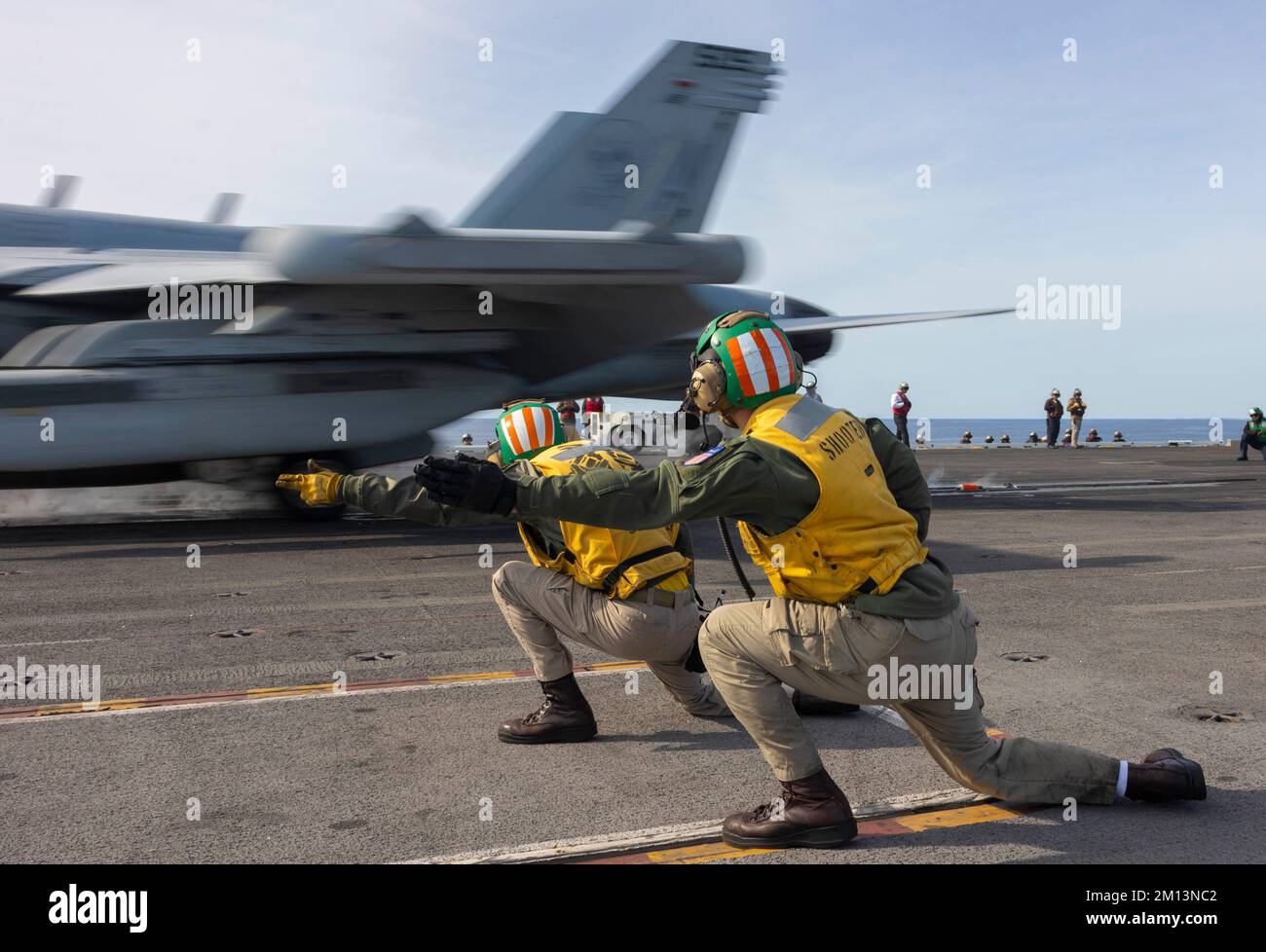Lt. Cmdr. Andrew Castro, front, from Knoxville, Tenn., and Lt. Bartley ...