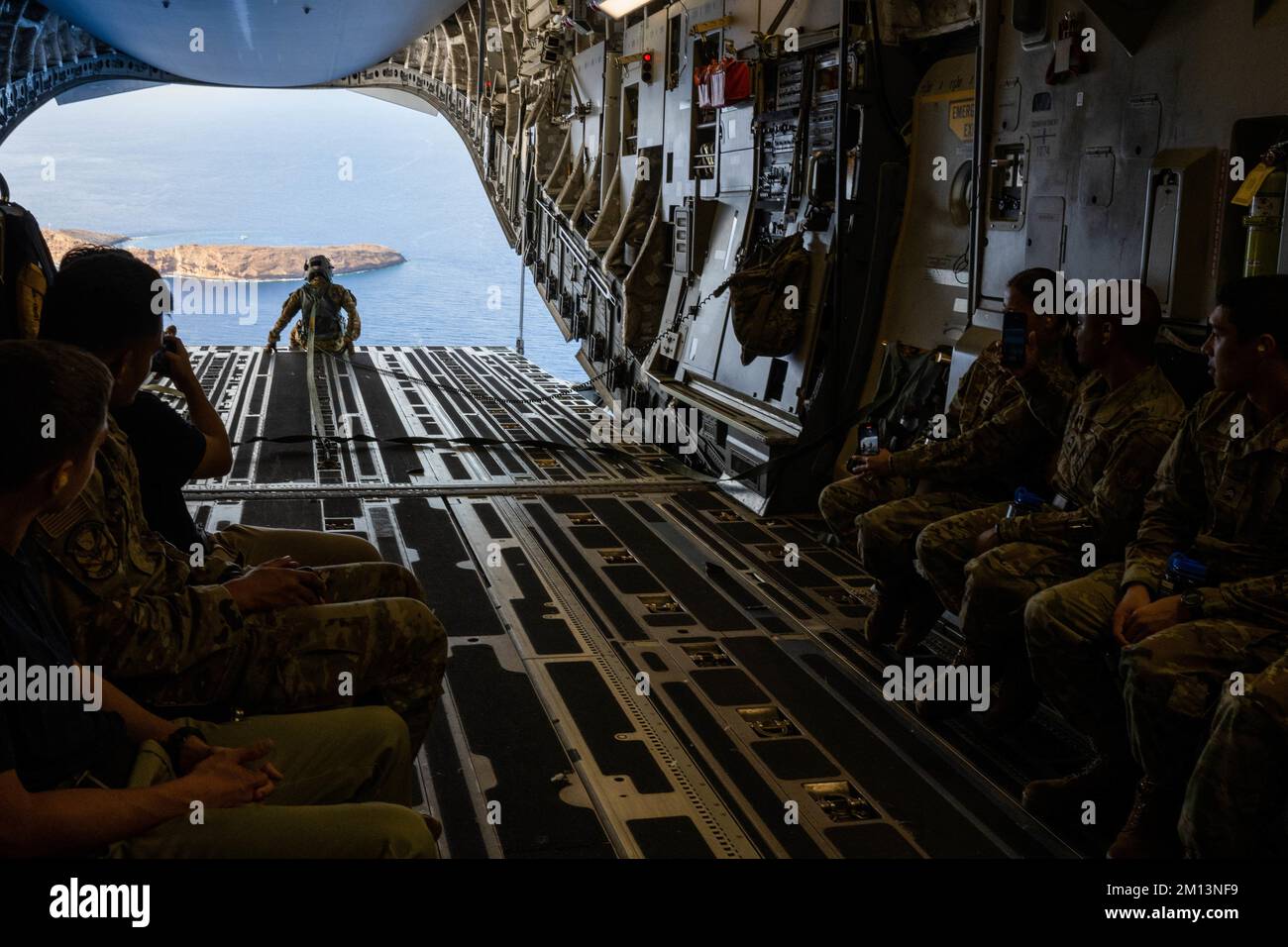 Senior Airman Anthony Wagnon, 535th Airlift Squadron loadmaster, sits ...