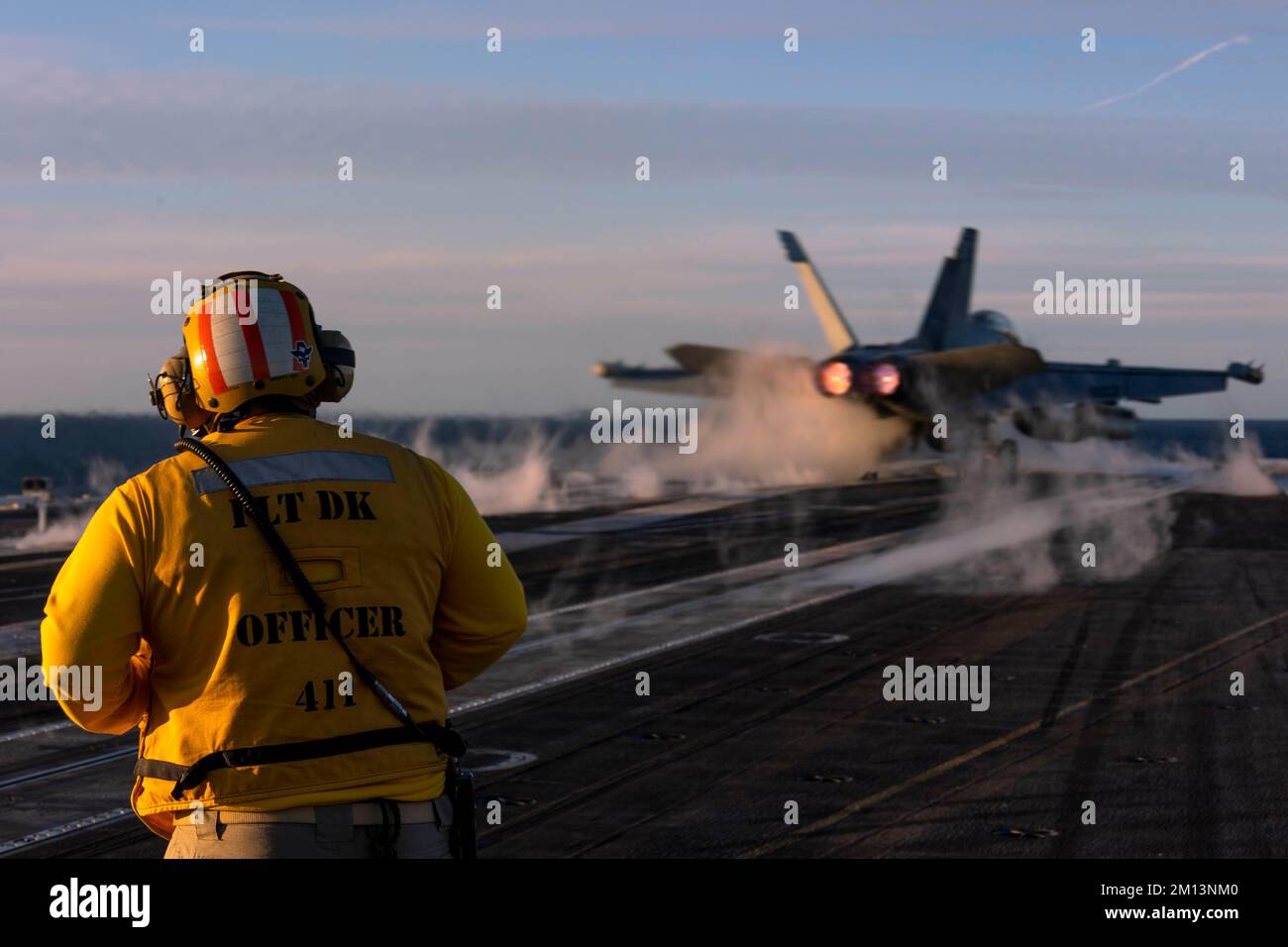 Lt. Julian Molinar, from Alpine, Texas, observes an EA-18G Growler ...