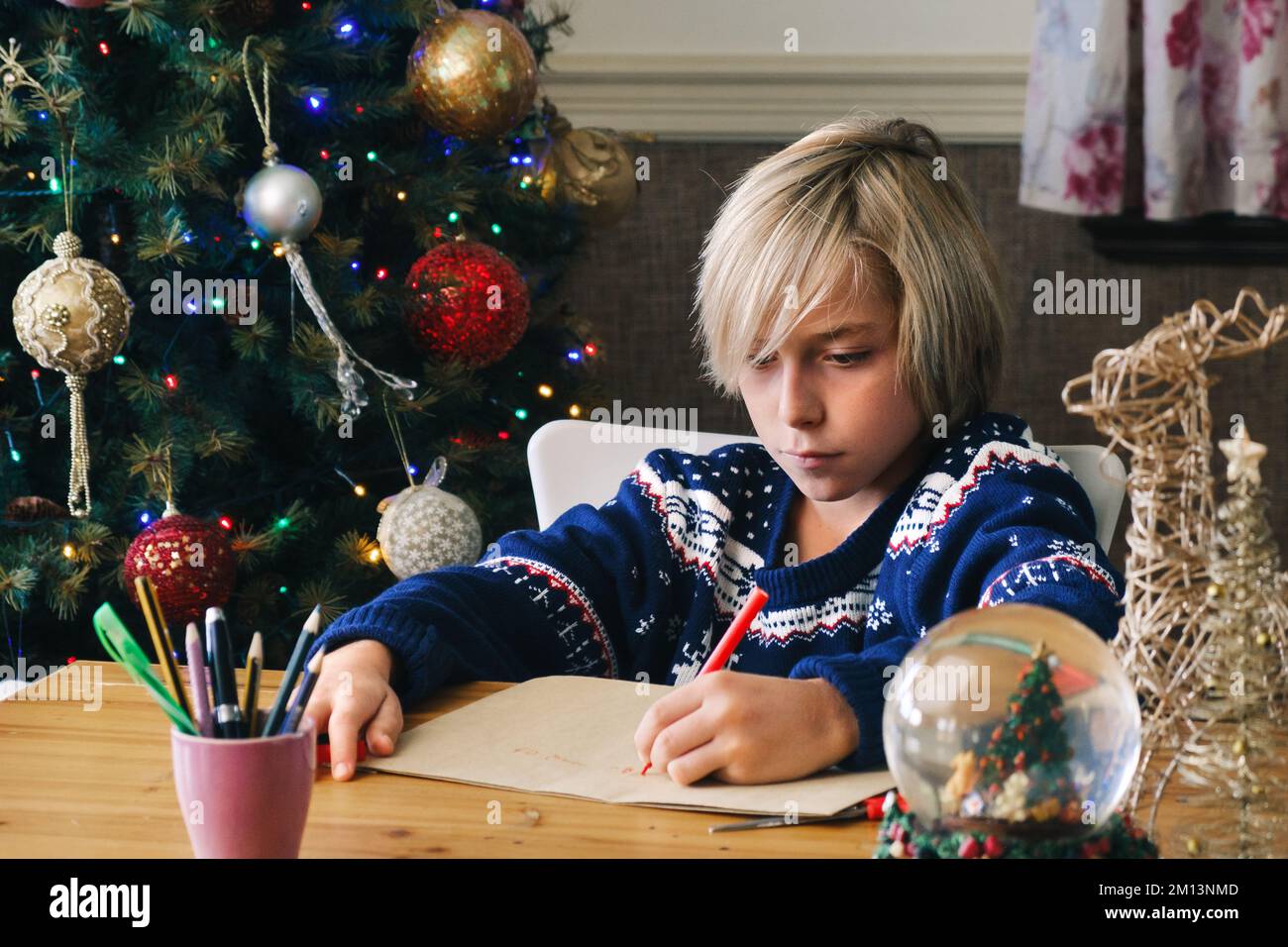Kid writing letter to Santa Clause Stock Photo - Alamy