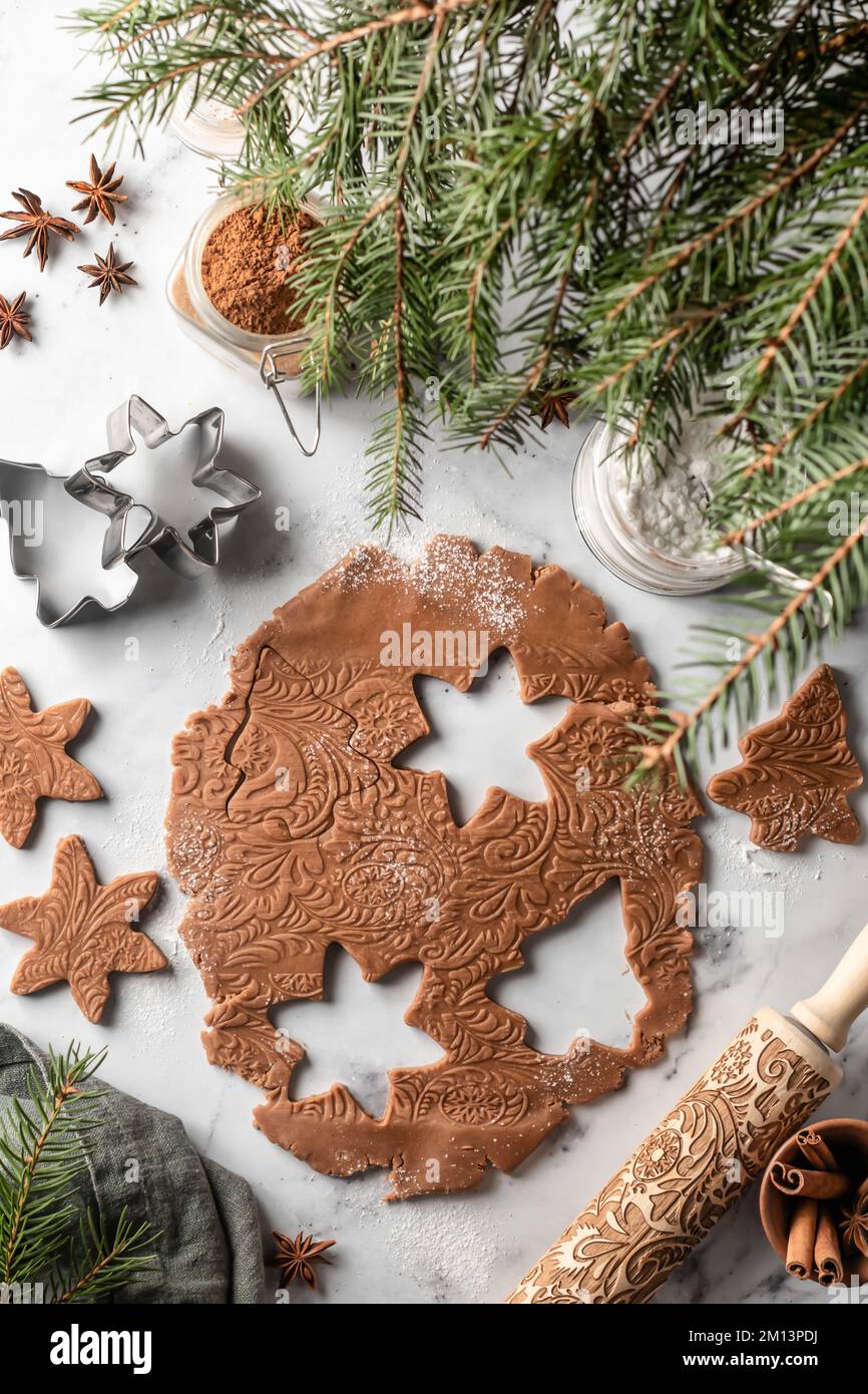 Process of making Christmas cookies. Dough, a figured rolling pin and ...