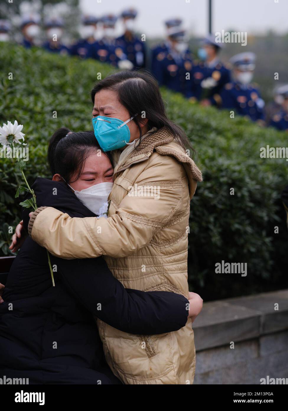 CHENGDU, CHINA - DECEMBER 9, 2022 - His wife (L) says goodbye to Lin ...