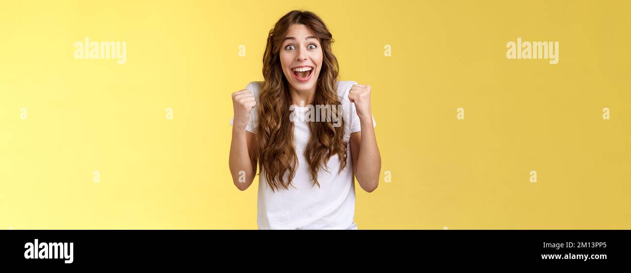 Cheerful supportive happy female fun fist pump relieved triumphing ...