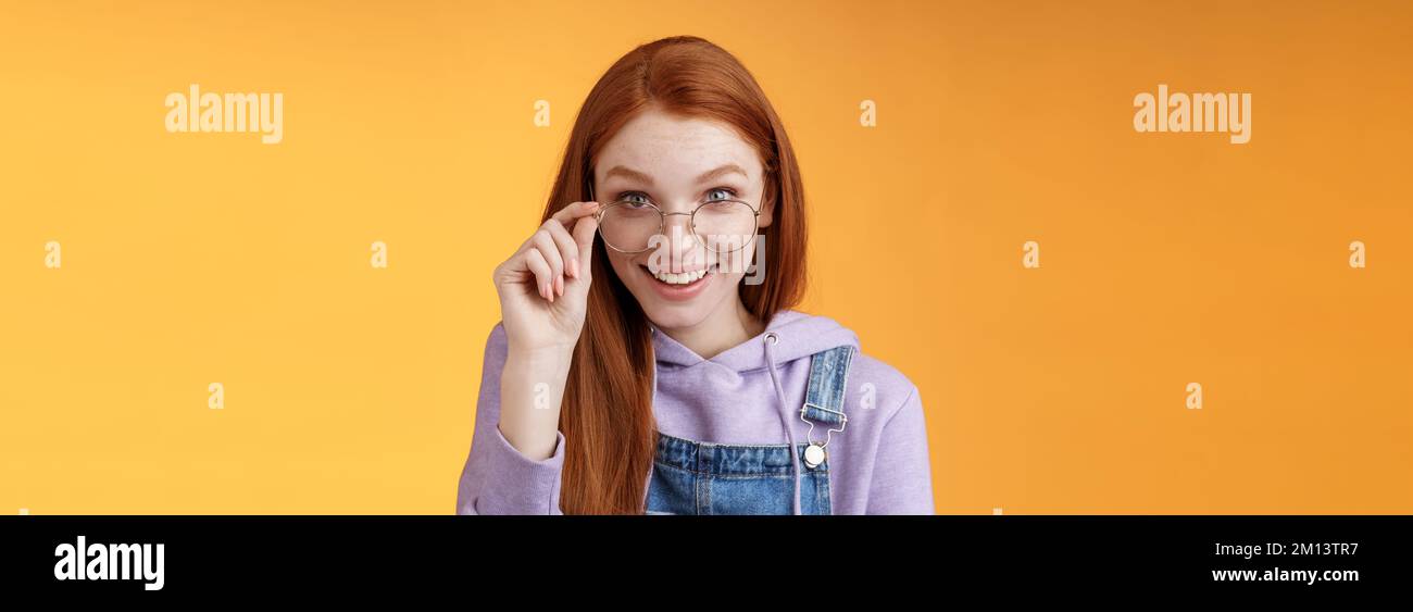 Charming silly modest young redhead female geek game lover discus last ...