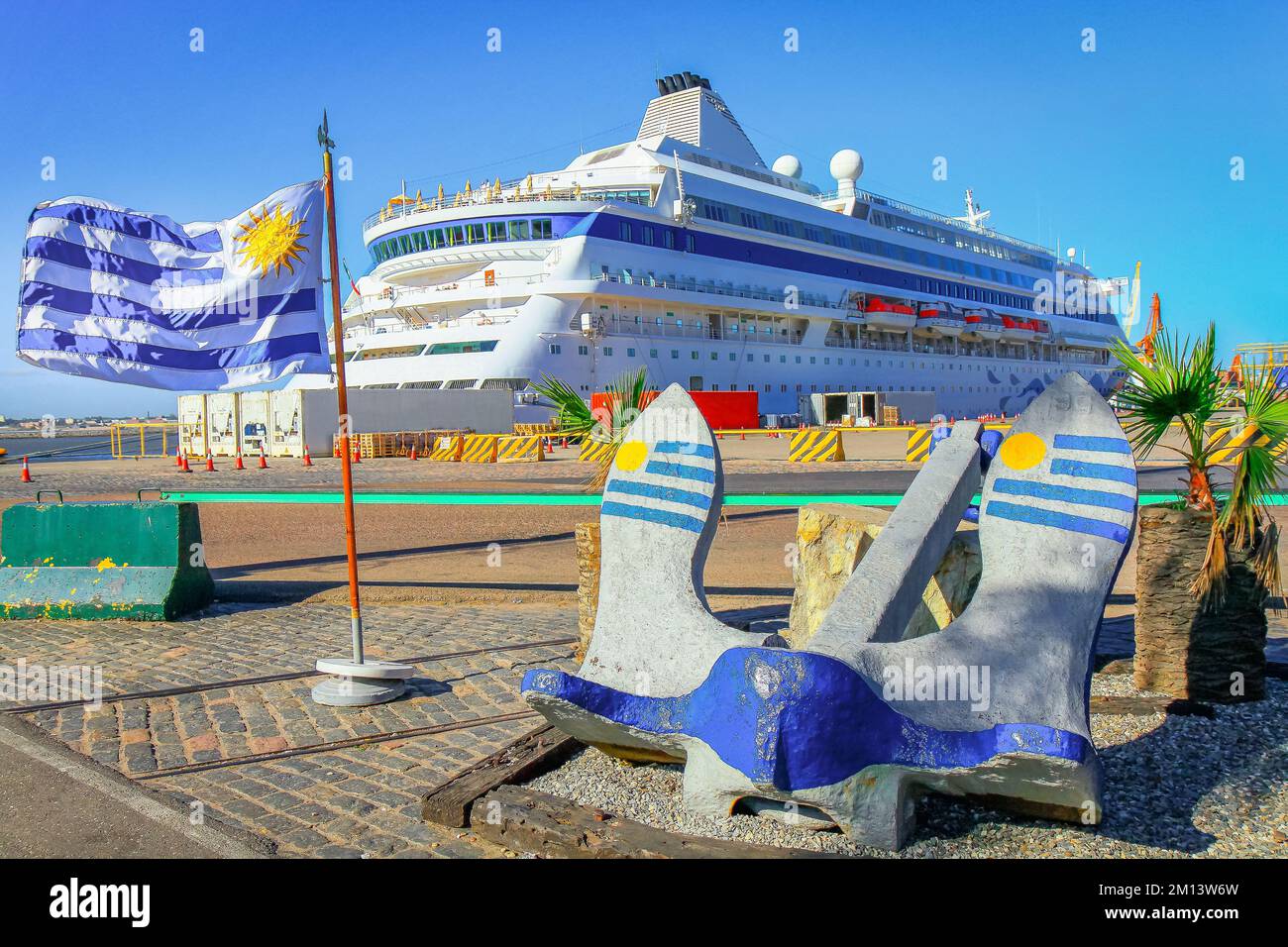 Montevideo harbor with ship cruise and Flag of Uruguay at sunny day ...