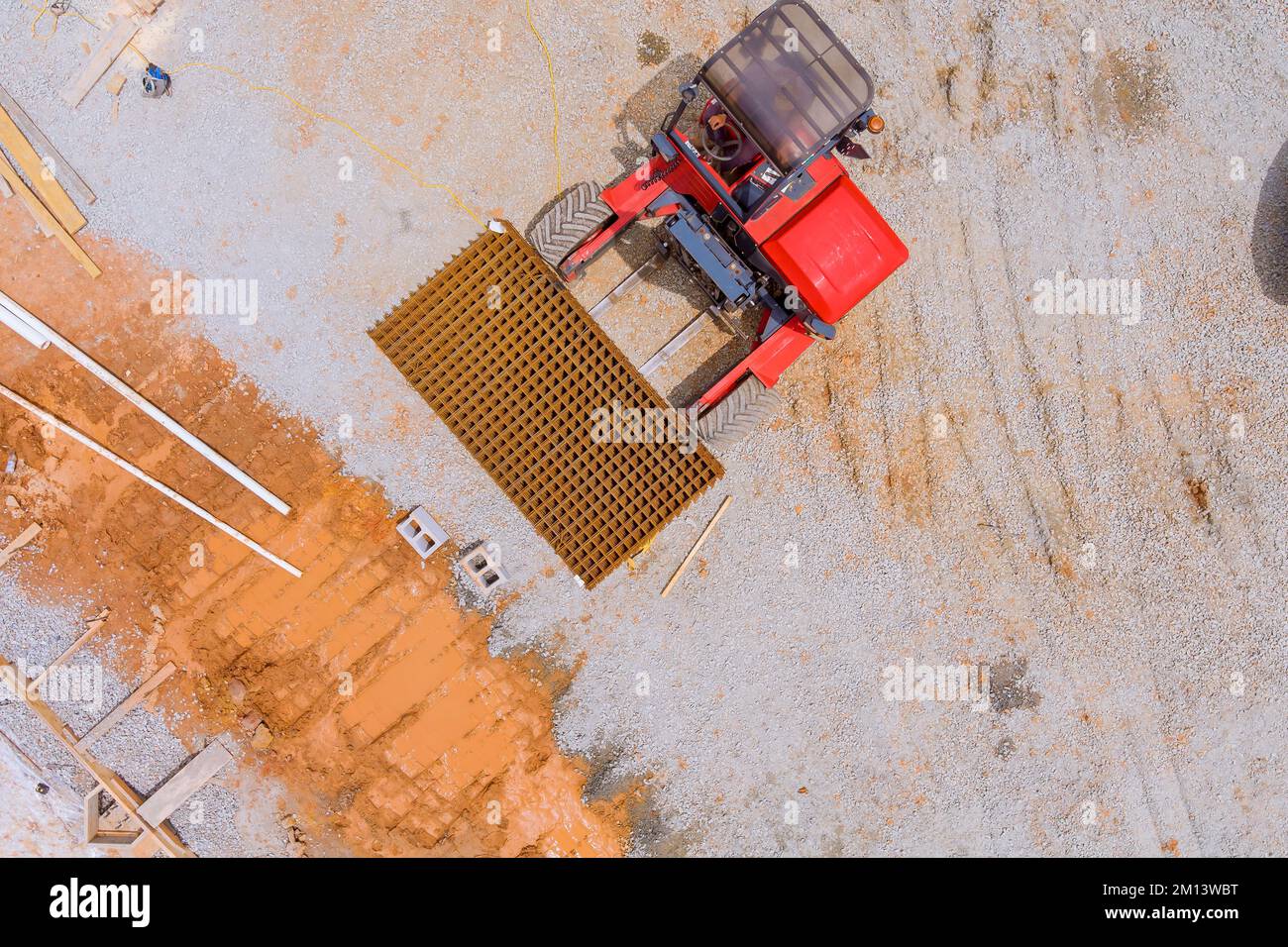 Forklift delivery on construction site reinforce concrete steel rods ...