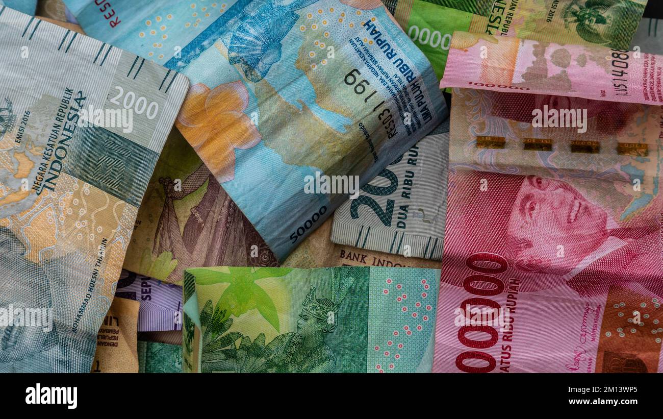 pile of rupiah banknotes as background Stock Photo - Alamy