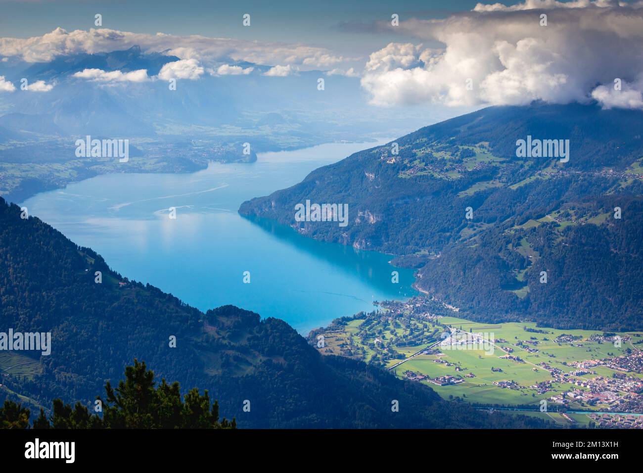Aerial view of Swiss Alps and Lake Thun at dramatic sunset, Interlaken ...