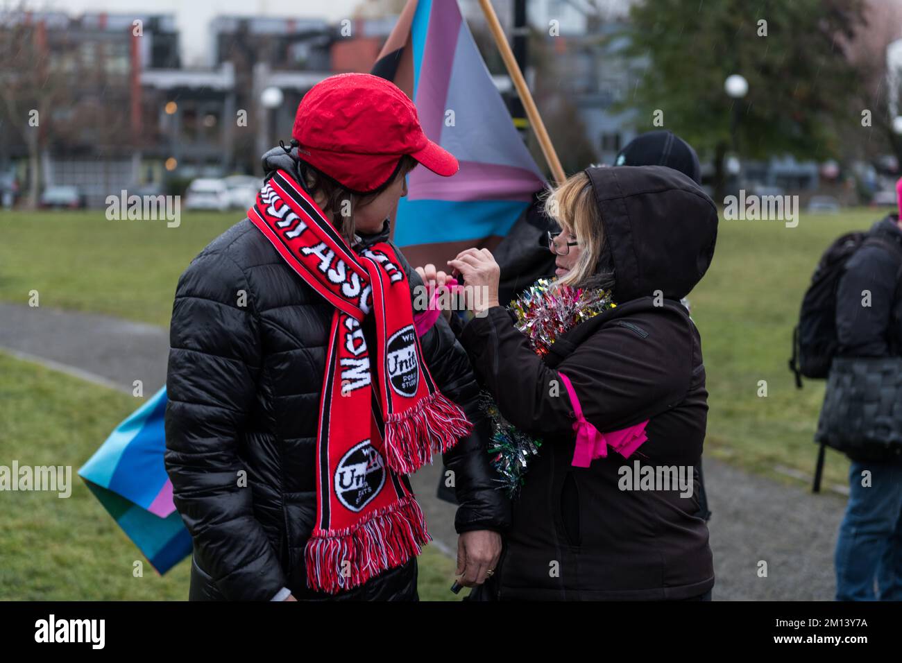 Seattle, USA. 9th Dec, 2022. People gather in the pouring rain at a ...