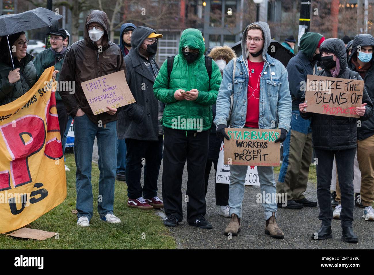 Seattle, USA. 9th Dec, 2022. People gather in the pouring rain at a ...