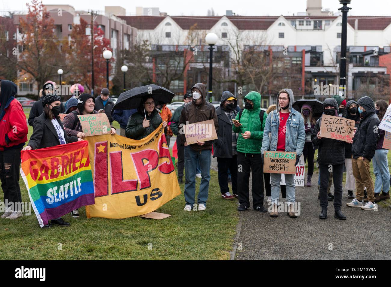 Seattle, USA. 9th Dec, 2022. People gather in the pouring rain at a ...