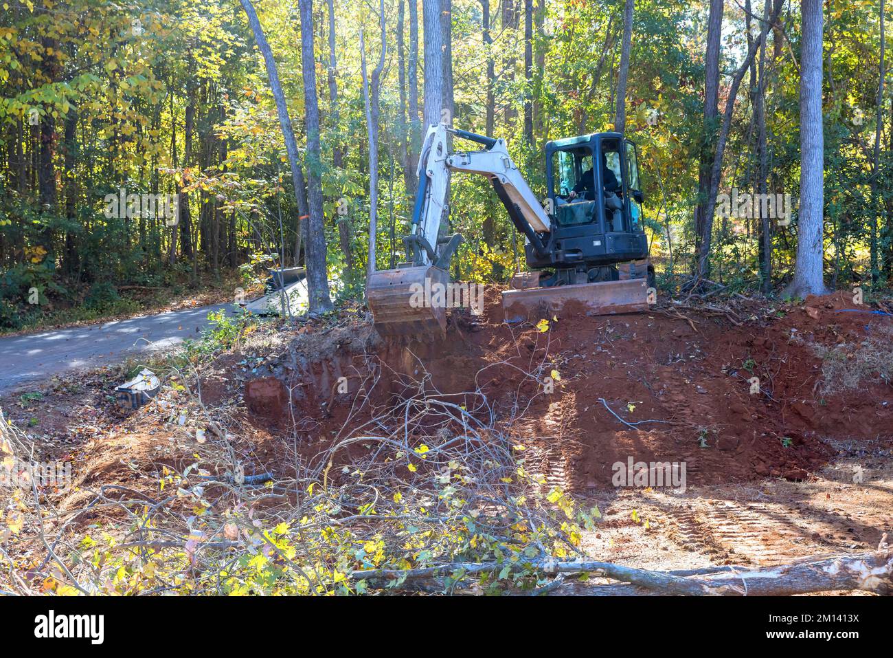 Uprooting trees and preparing land for construction is done with ...