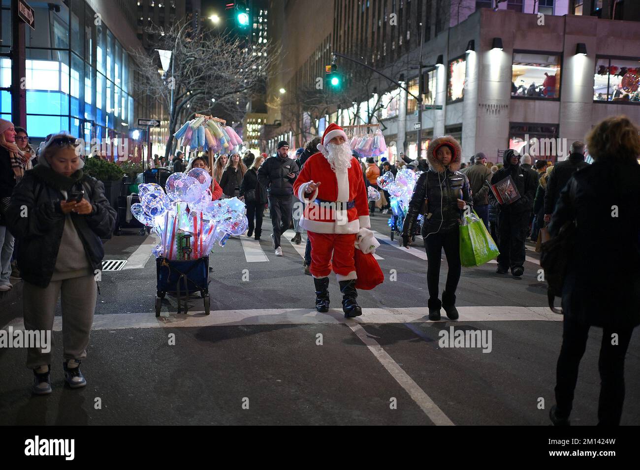 New York, USA. 09th Dec, 2022. A busker dressed as Santa Clause walks ...