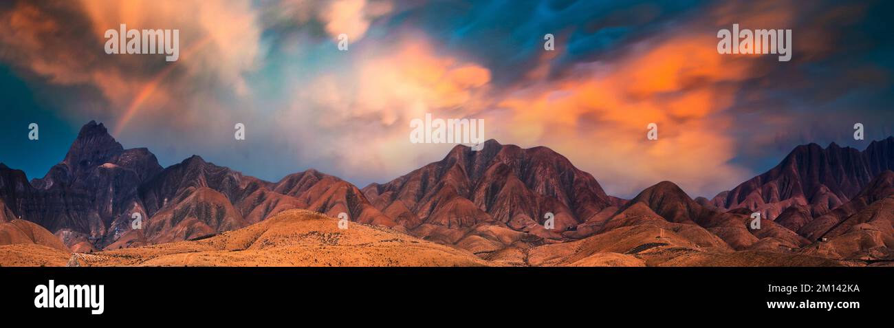 Mountain range at sunset Stock Photo - Alamy