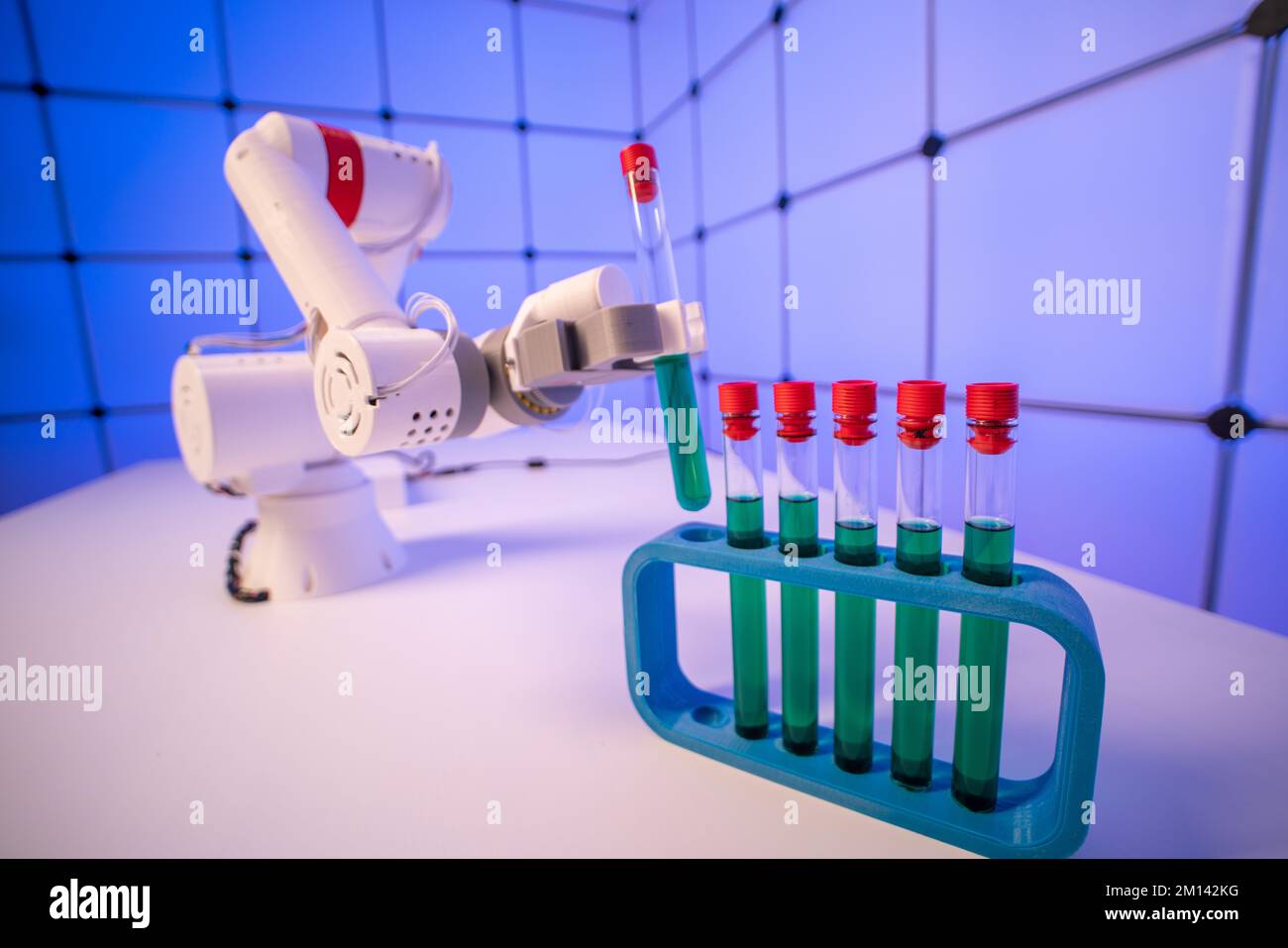 Robotic arm holding test tube Stock Photo - Alamy