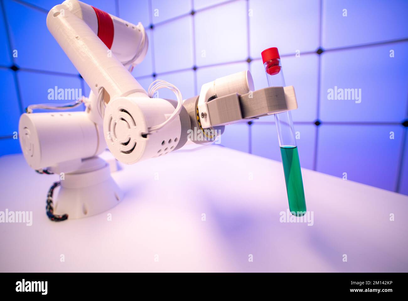 Robotic arm holding test tube Stock Photo - Alamy