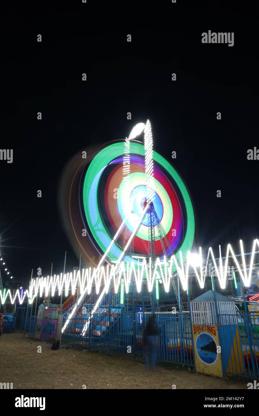 Long Exposure slow shutter speed Shot of a Spinning Ferris Wheel with ...