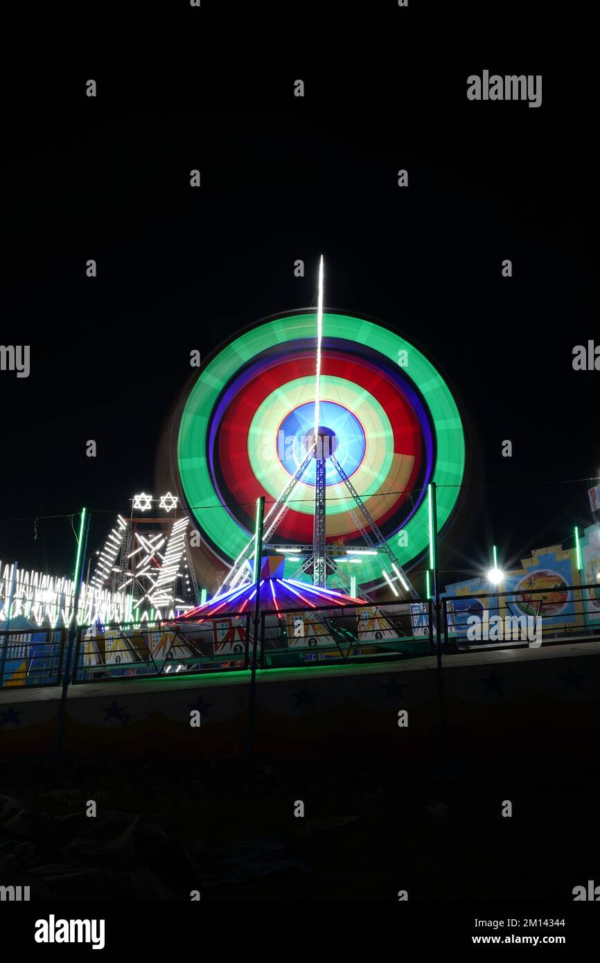 Long Exposure slow shutter speed Shot of a Spinning Ferris Wheel with ...