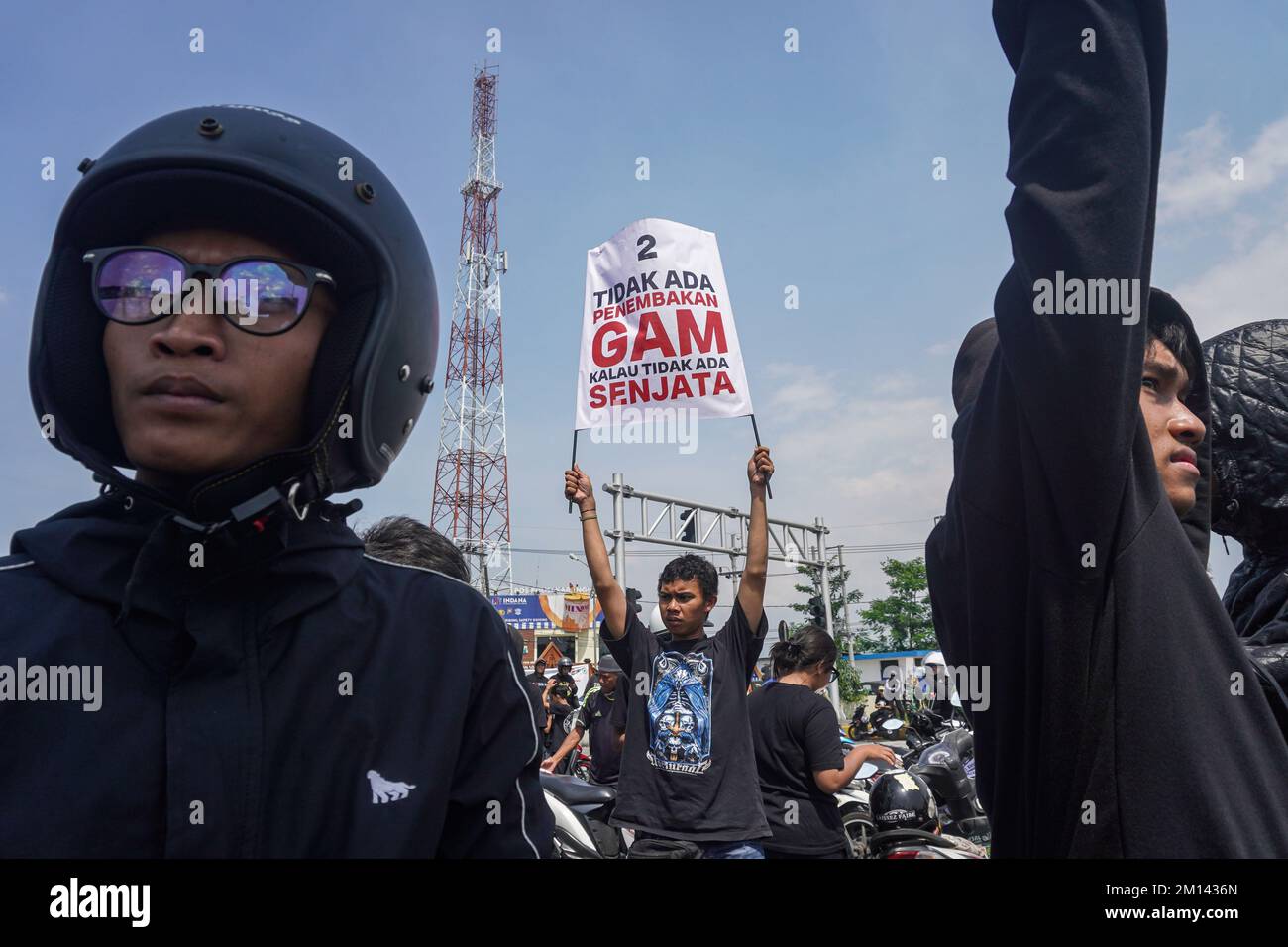 A demonstrator holds a placard during the protest. Aremania, the ...