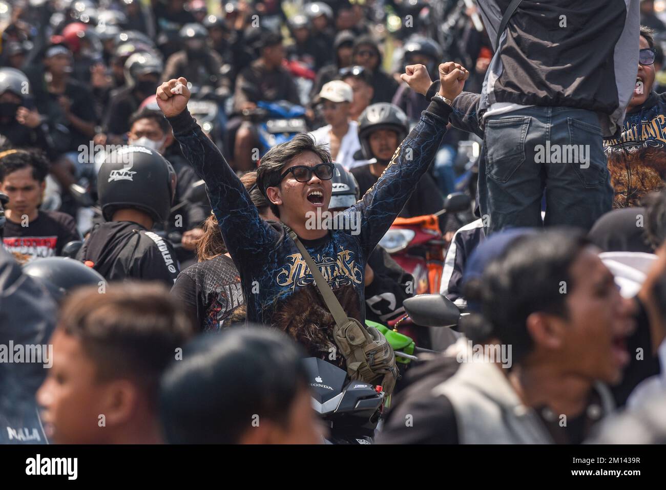 A demonstrator shouts slogans during the protestís cavalcade. Aremania ...