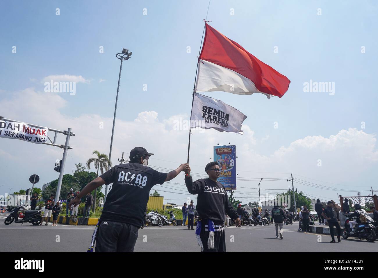 Malang, Indonesia. 08th Dec, 2022. A demonstrator carries an Indonesian ...