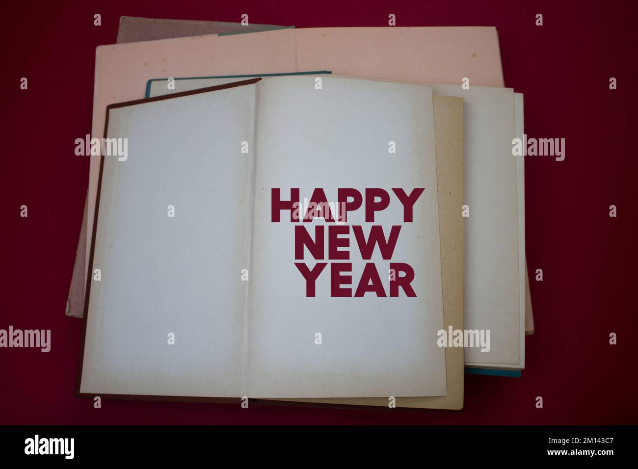 Happy New Year word in opened book with vintage, natural patterns old ...