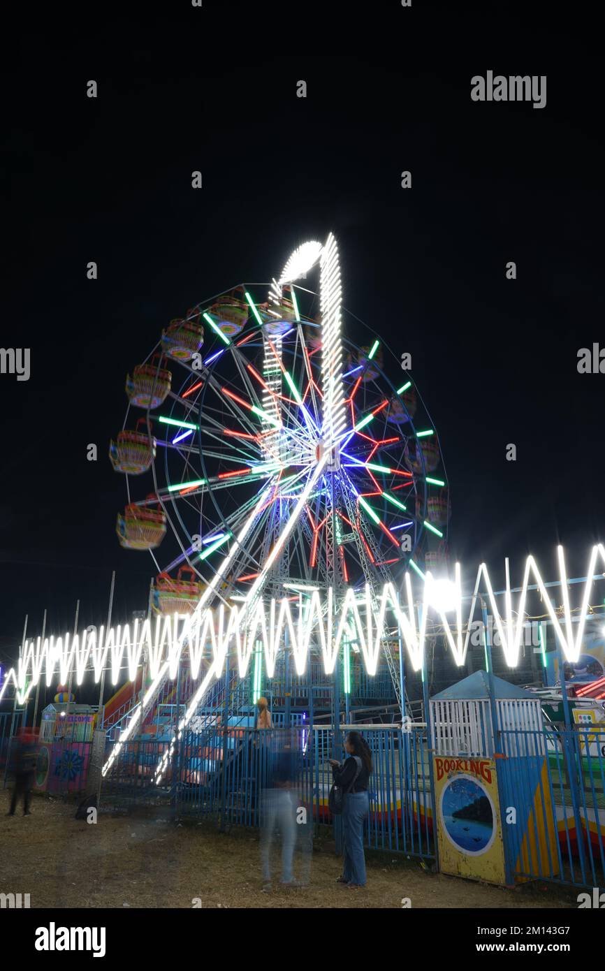 Giant Ferris wheel in indian fair at night, vertical photographs ...
