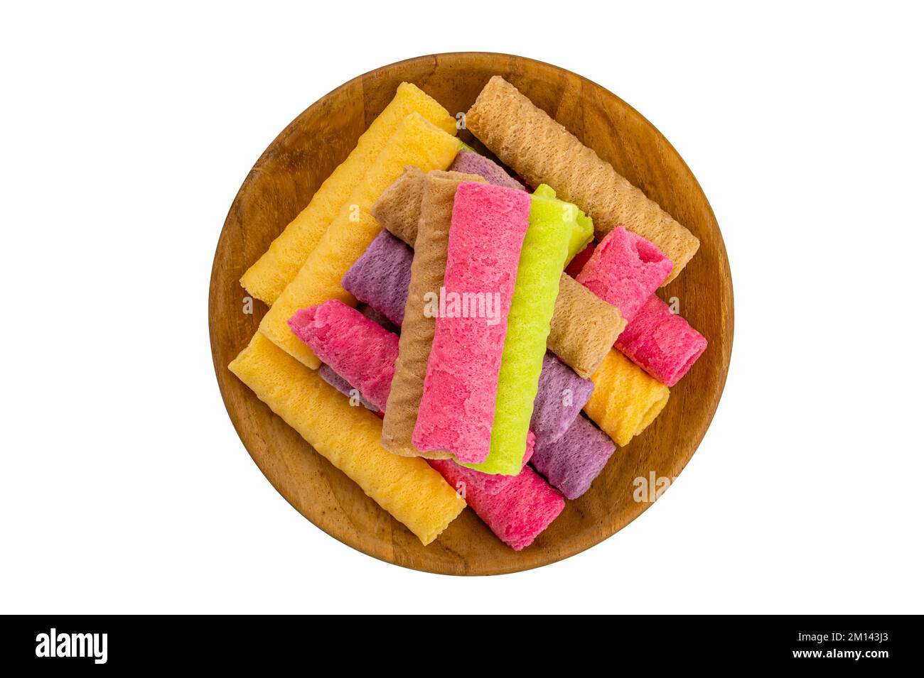 Top view pile of colorful homemade crispy coconut wafer tube in wooden ...