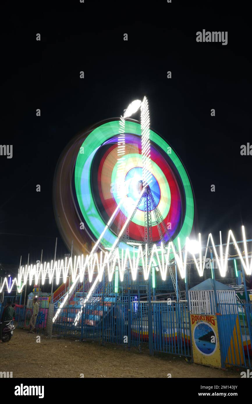 Long Exposure slow shutter speed Shot of a Spinning Ferris Wheel with ...
