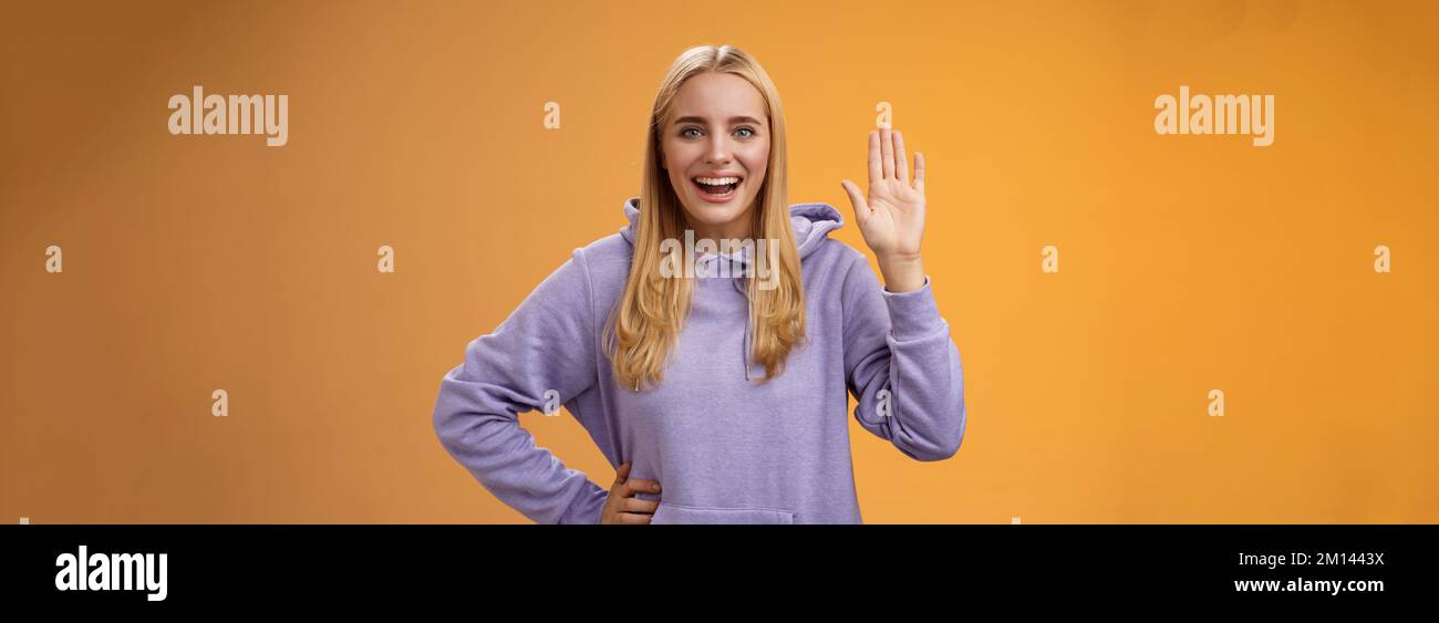 Friendly energized helpful charming female student say hello newcomers ...