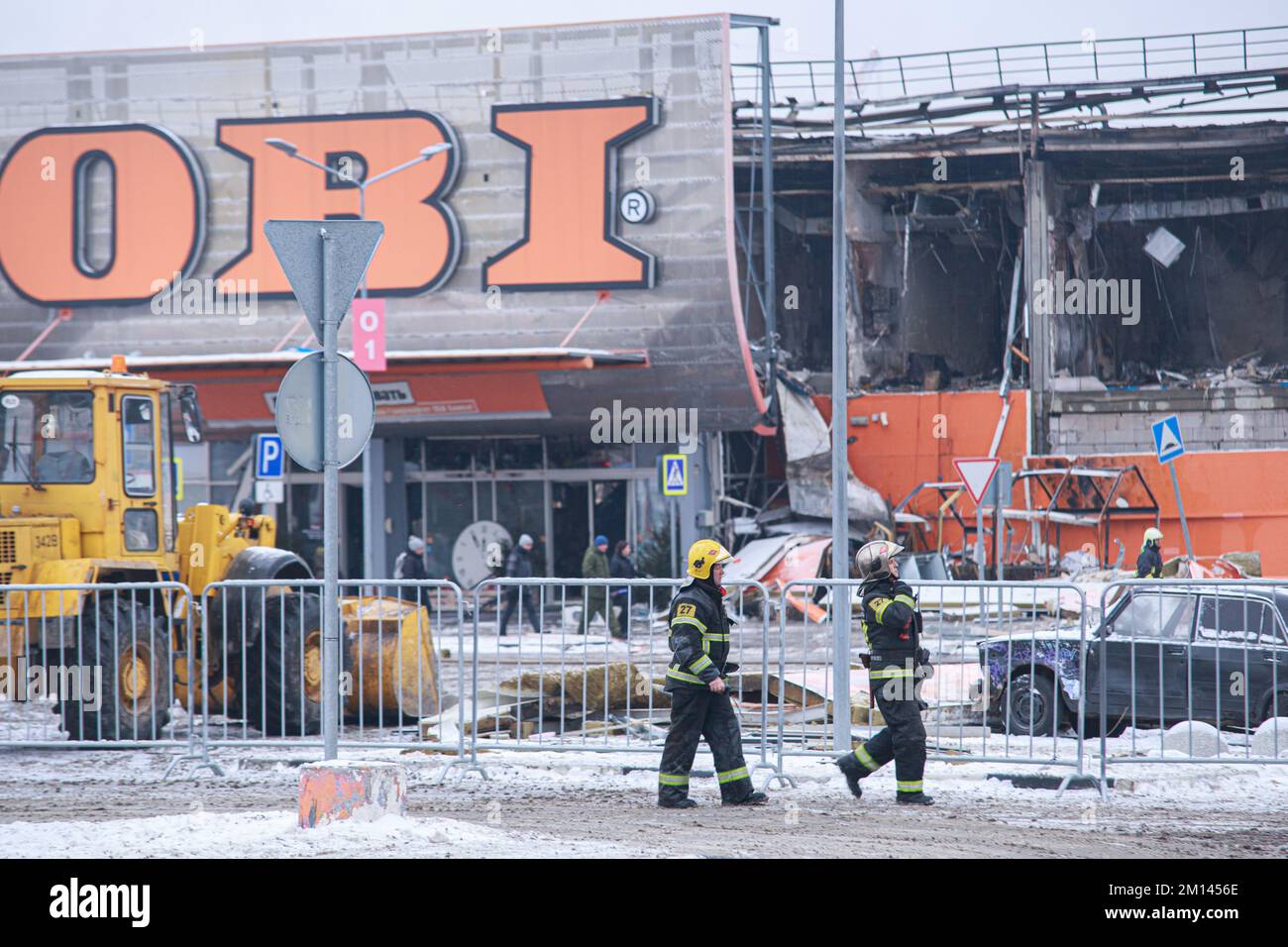 Firefighters seen after extinguishing the OBI hypermarket. The ...
