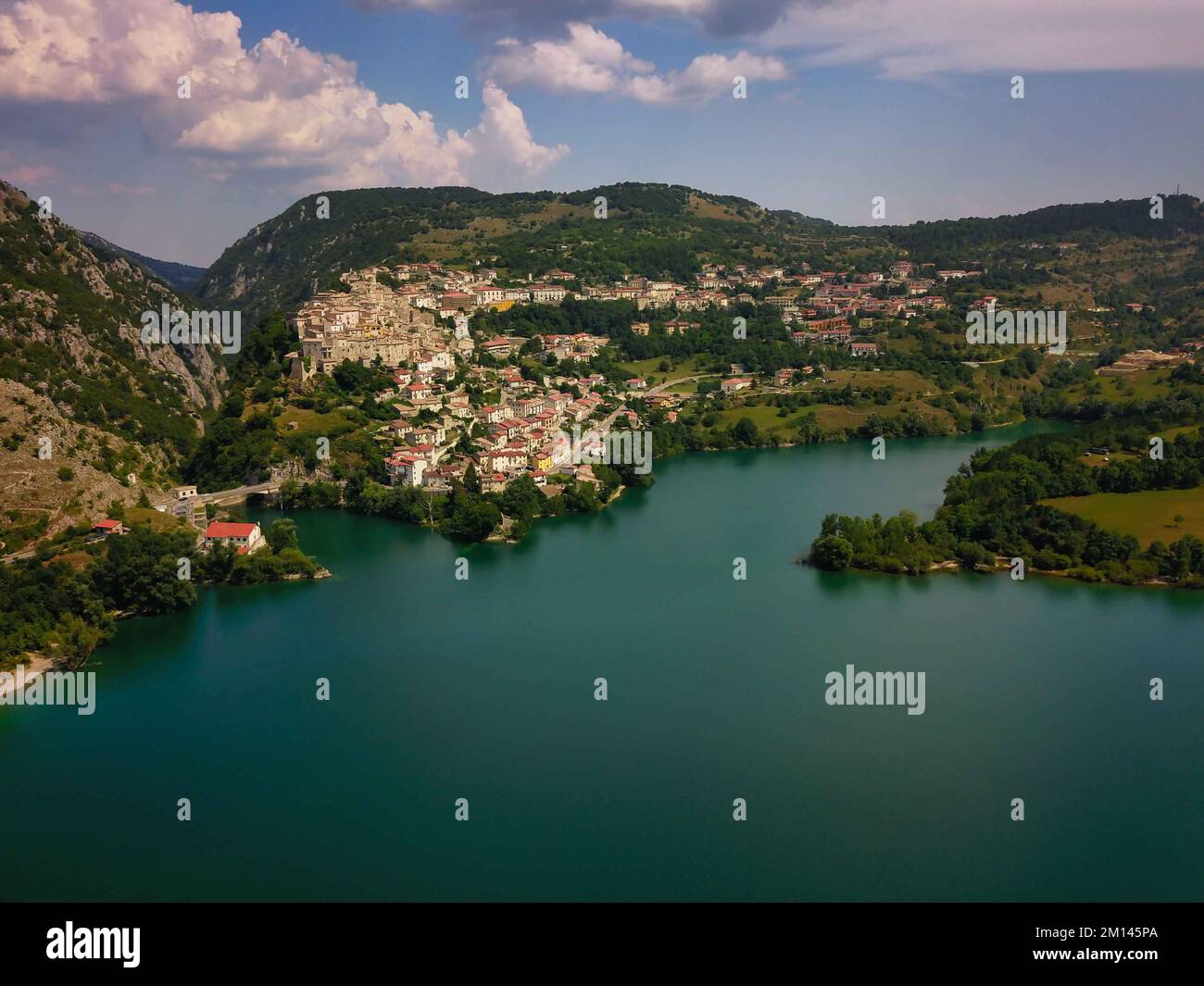 An aerial view of Villetta Barrea with rural houses by Sangro river ...