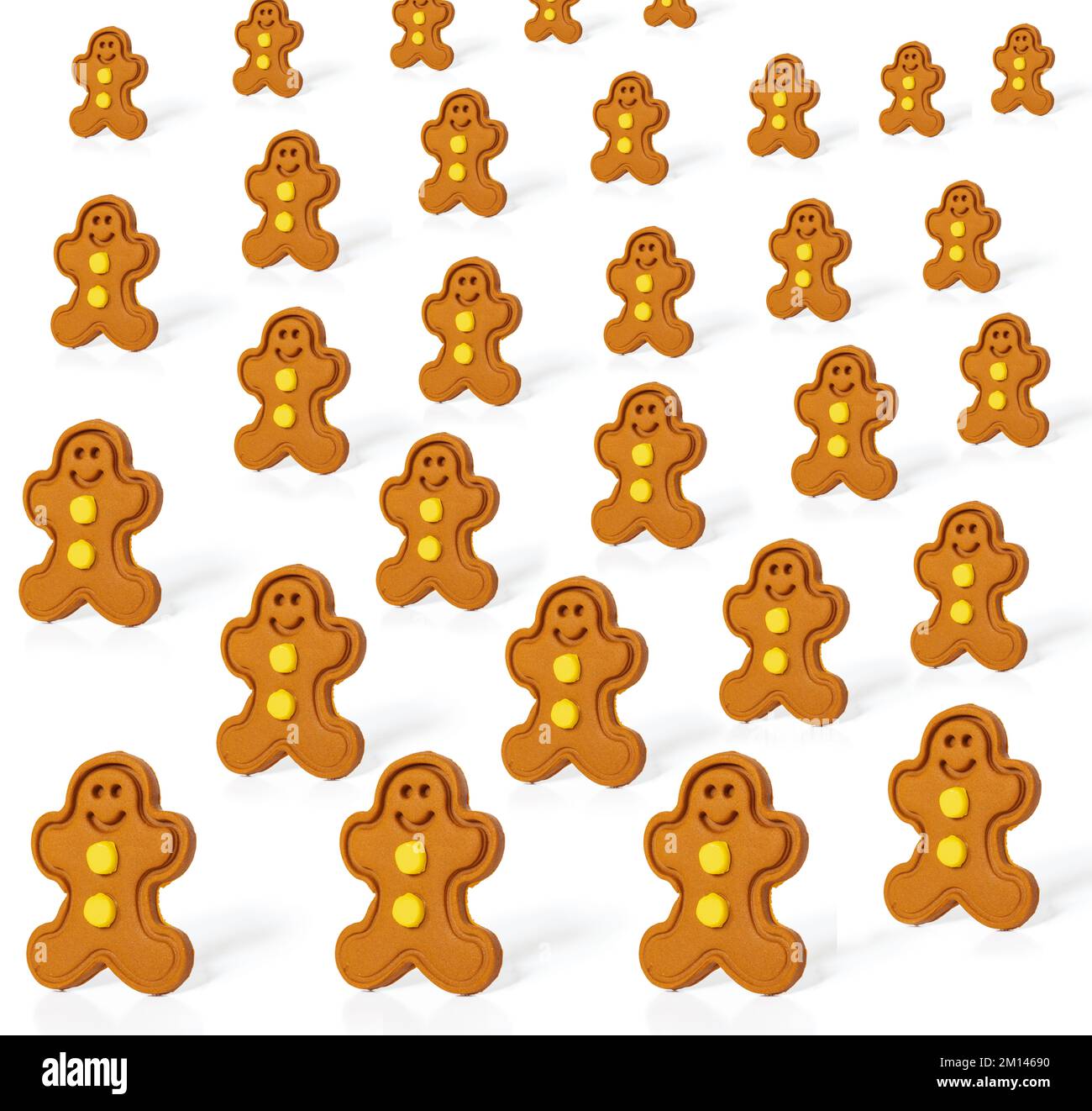 A lines of Gingerbread men on a white background Stock Photo - Alamy