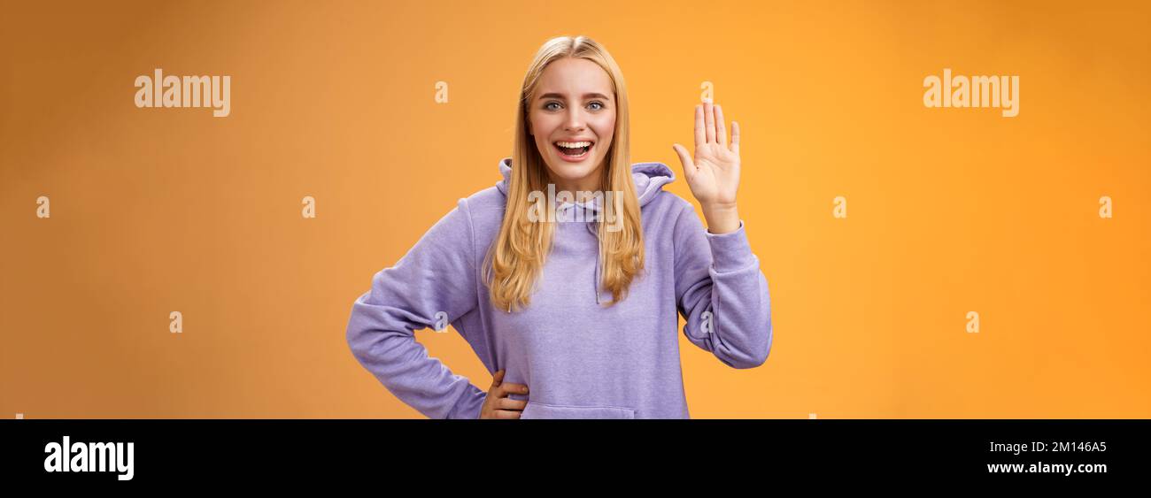 Friendly energized helpful charming female student say hello newcomers ...