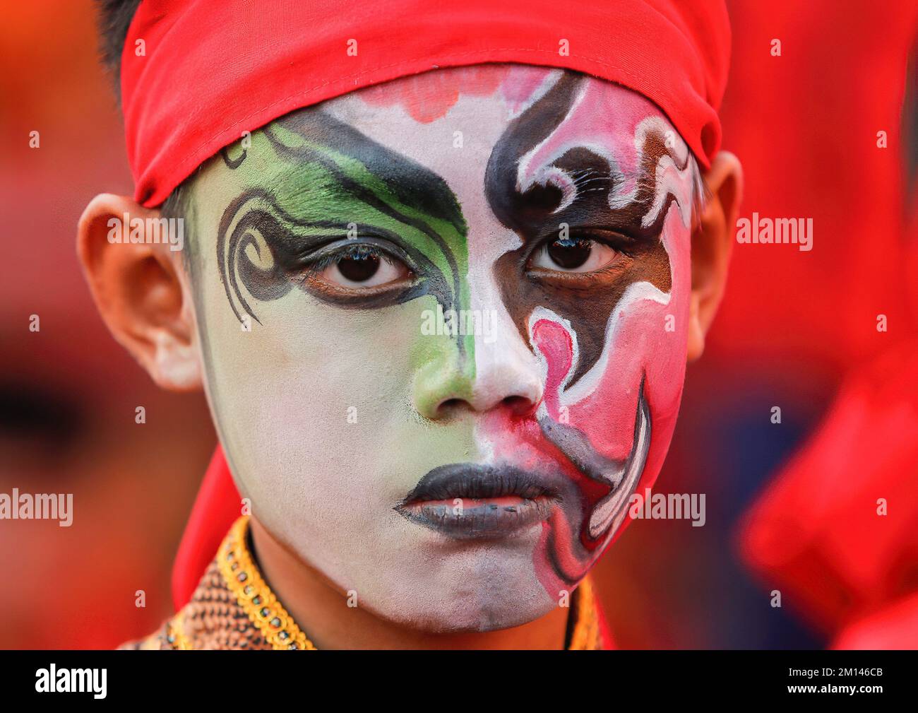 A performance in a costume and painted face performs in 108 the great ...