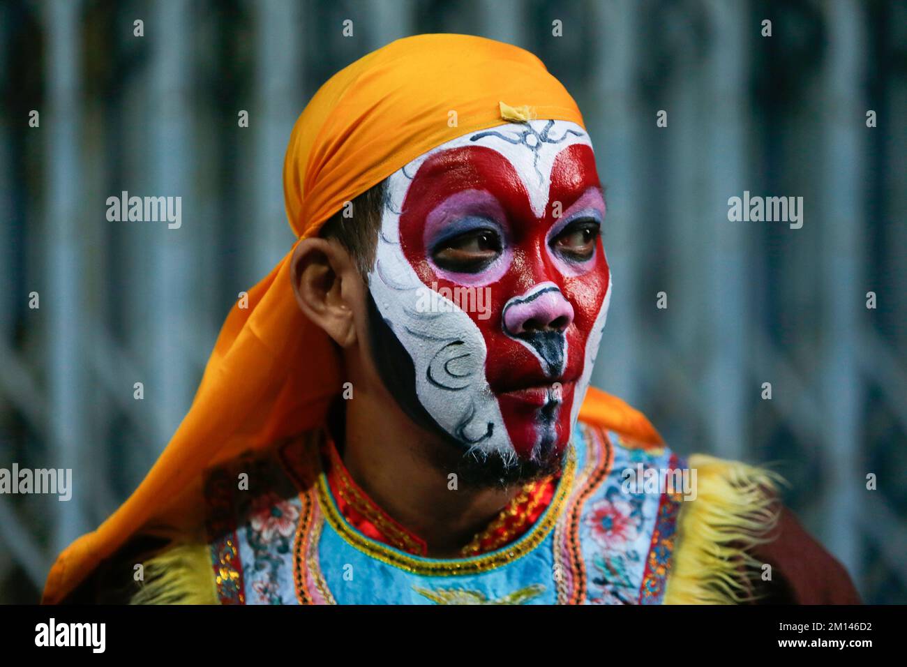 A performance in a costume and painted face performs in 108 the great ...