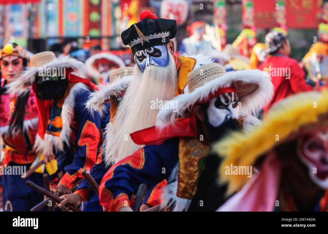 Performers in costumes and painted faces perform in 108 the great dance ...