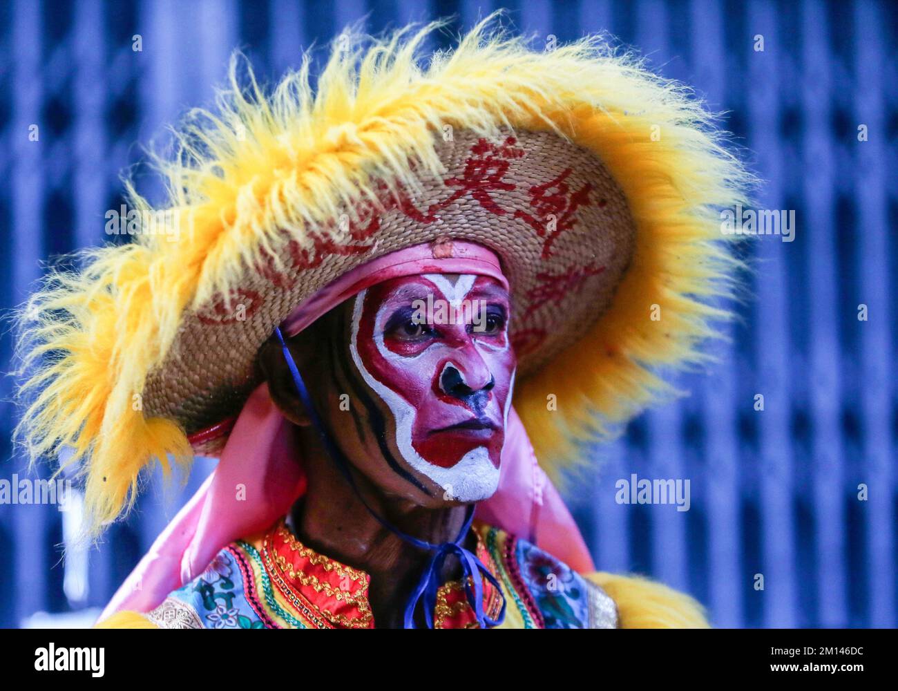 A performance in a costume and painted face performs in 108 the great ...