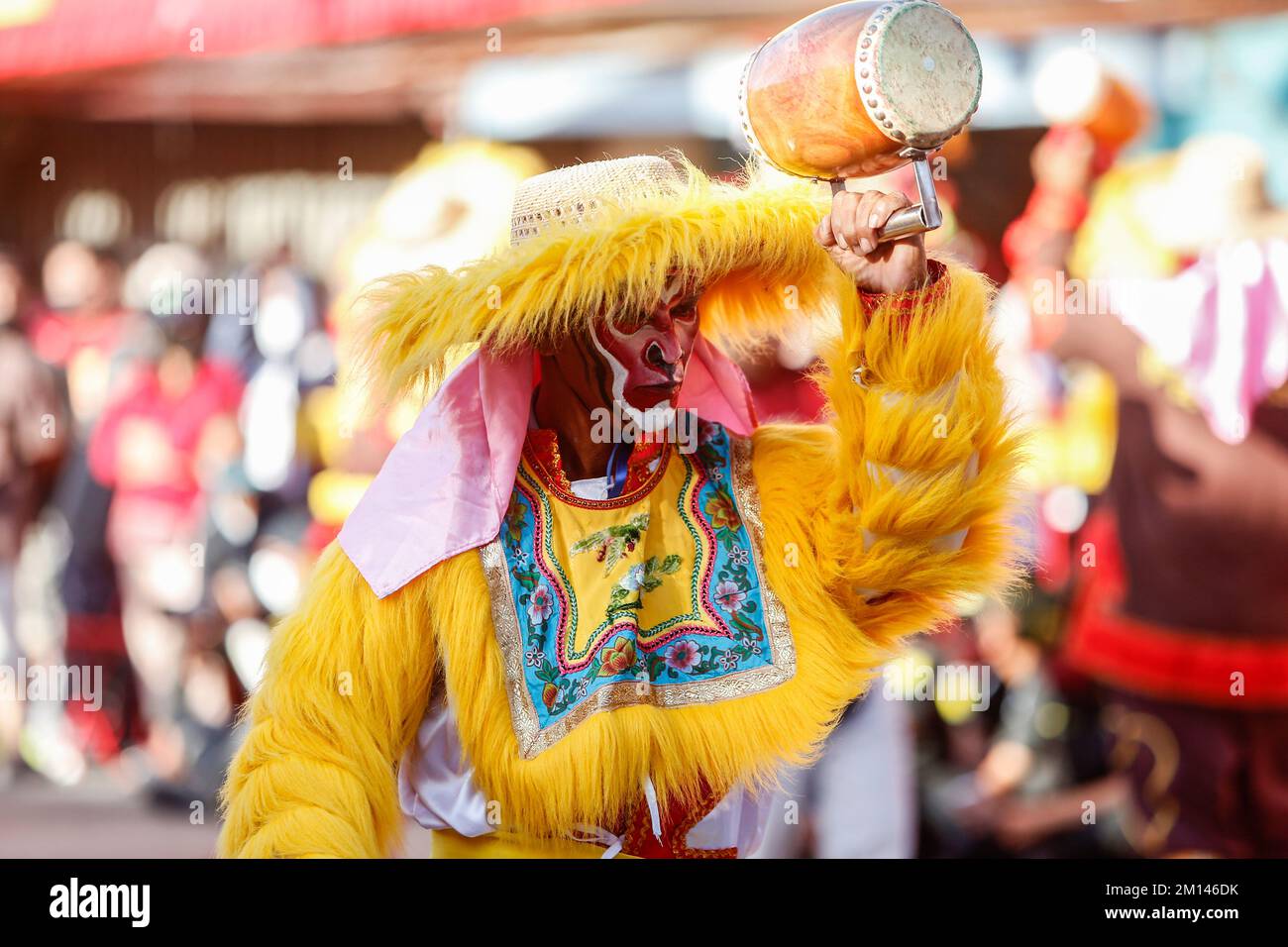 A performance in a costume and painted face performs in 108 the great ...