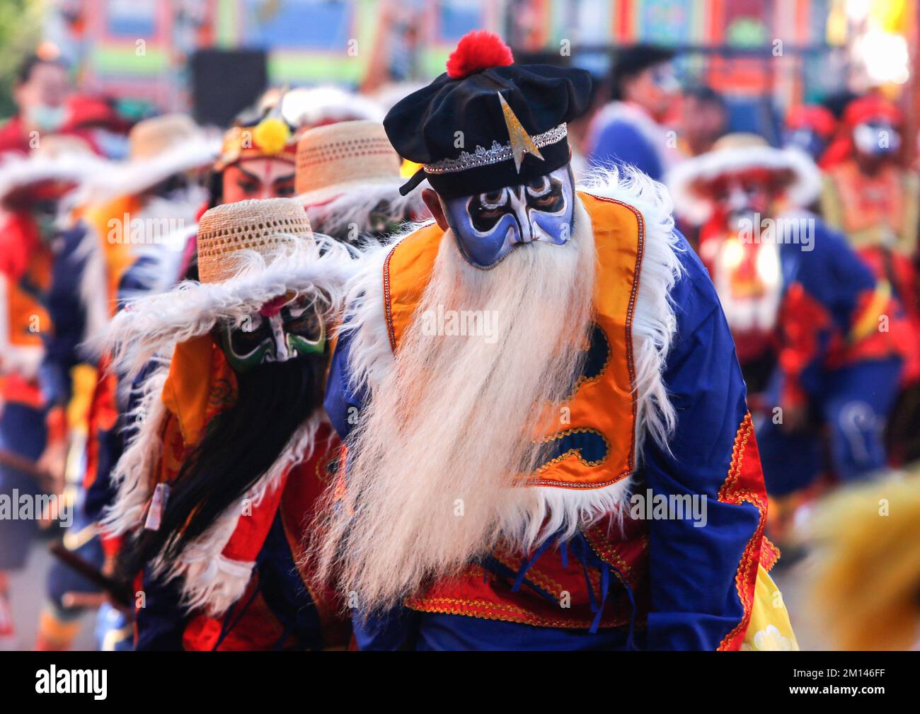 Performers in costumes and painted faces perform in 108 the great dance ...