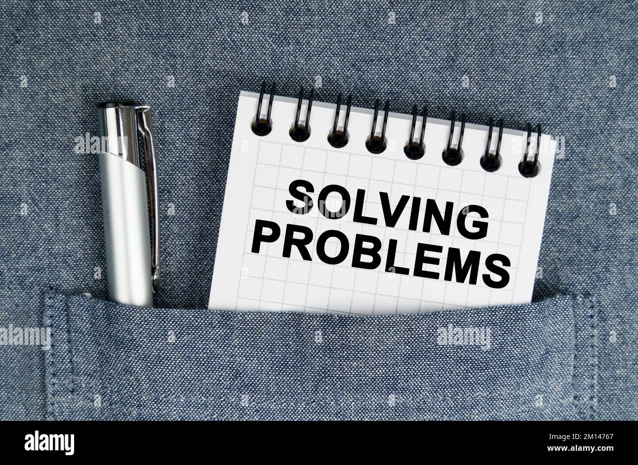 Business and finance concept. In my pocket is a pen and a notebook with the inscription ...