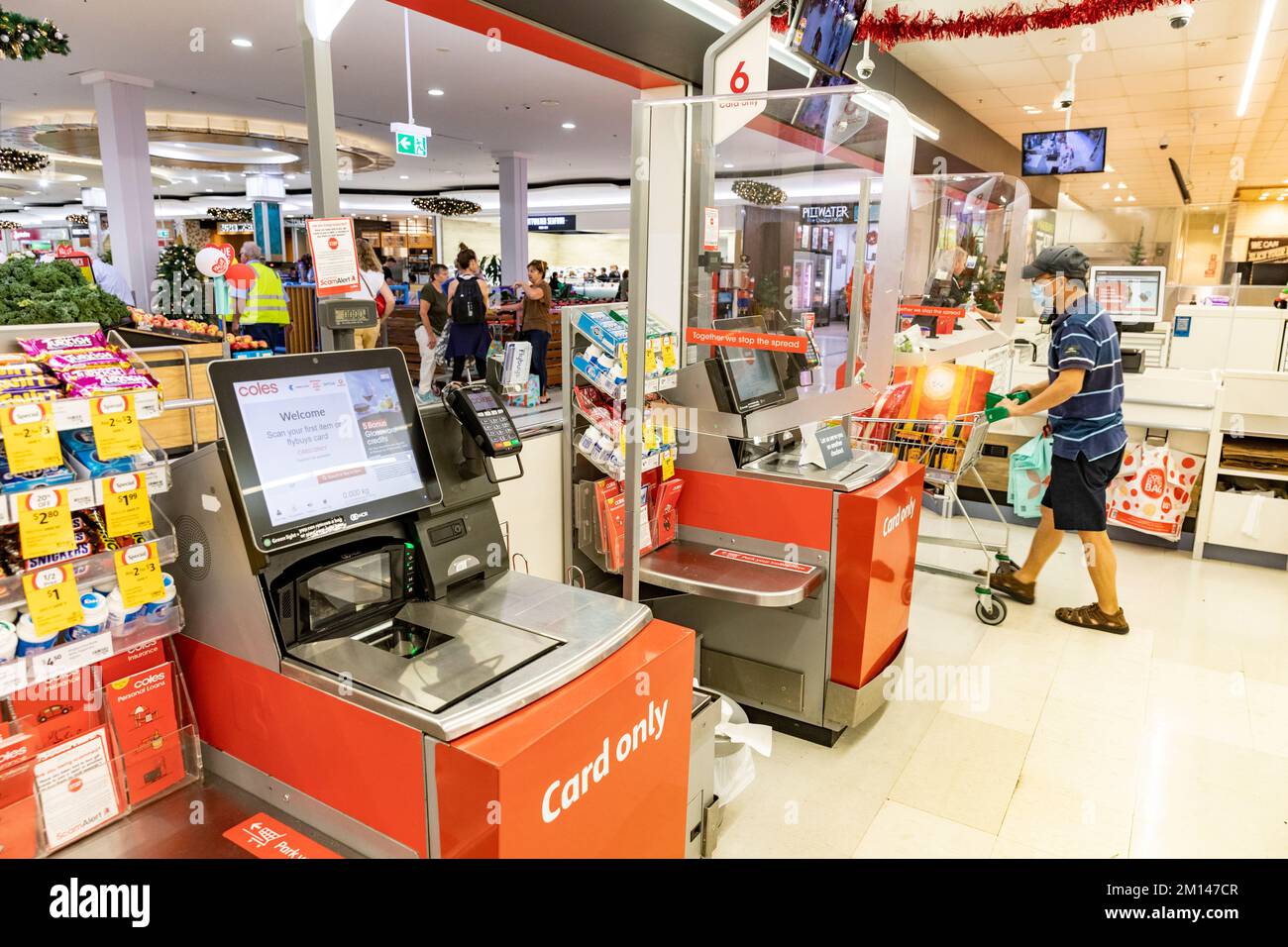 Coles supermarket Australia man shopping with supermarket trolley and ...