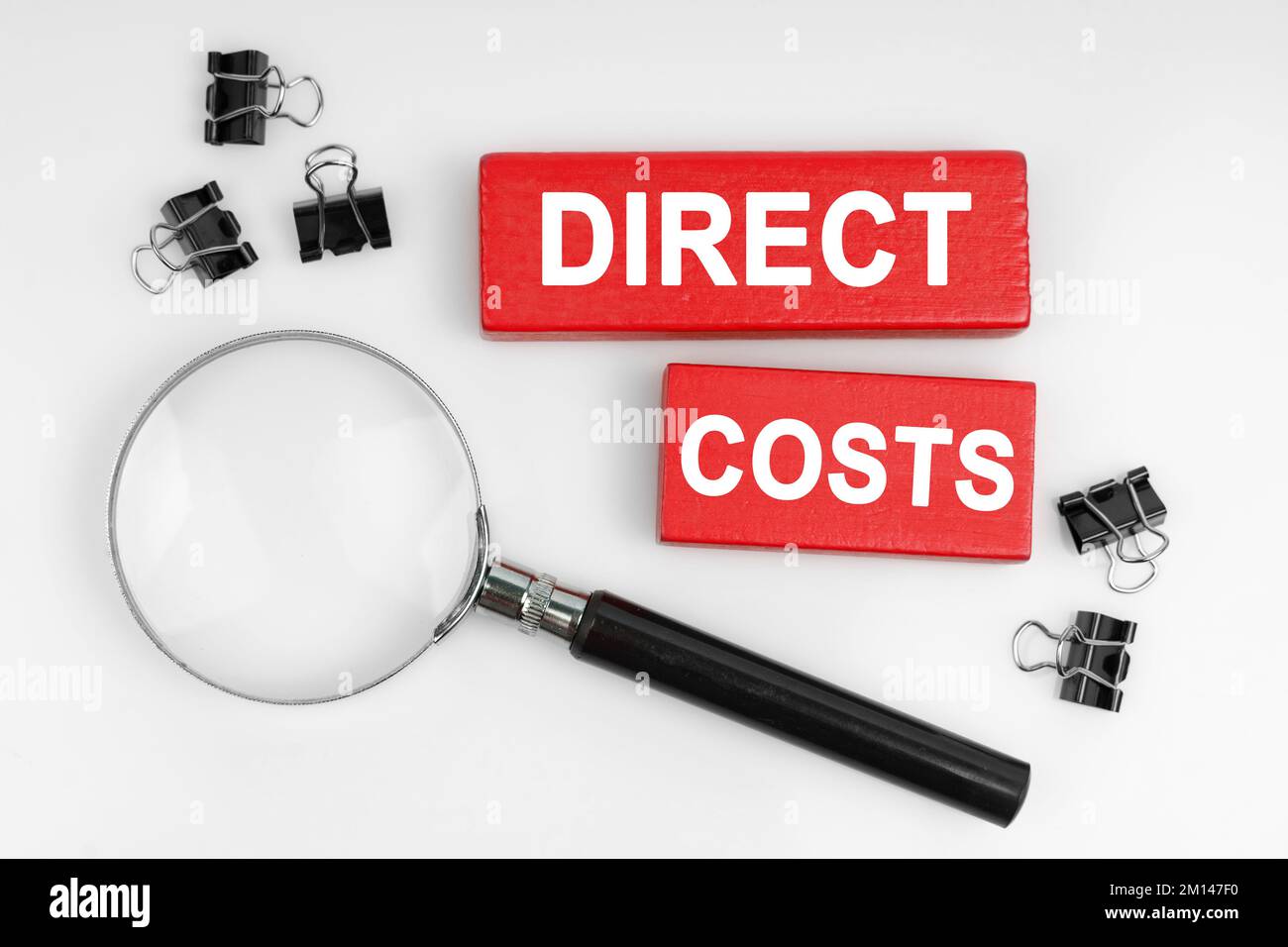 Business concept. On a white background, a magnifying glass and red ...