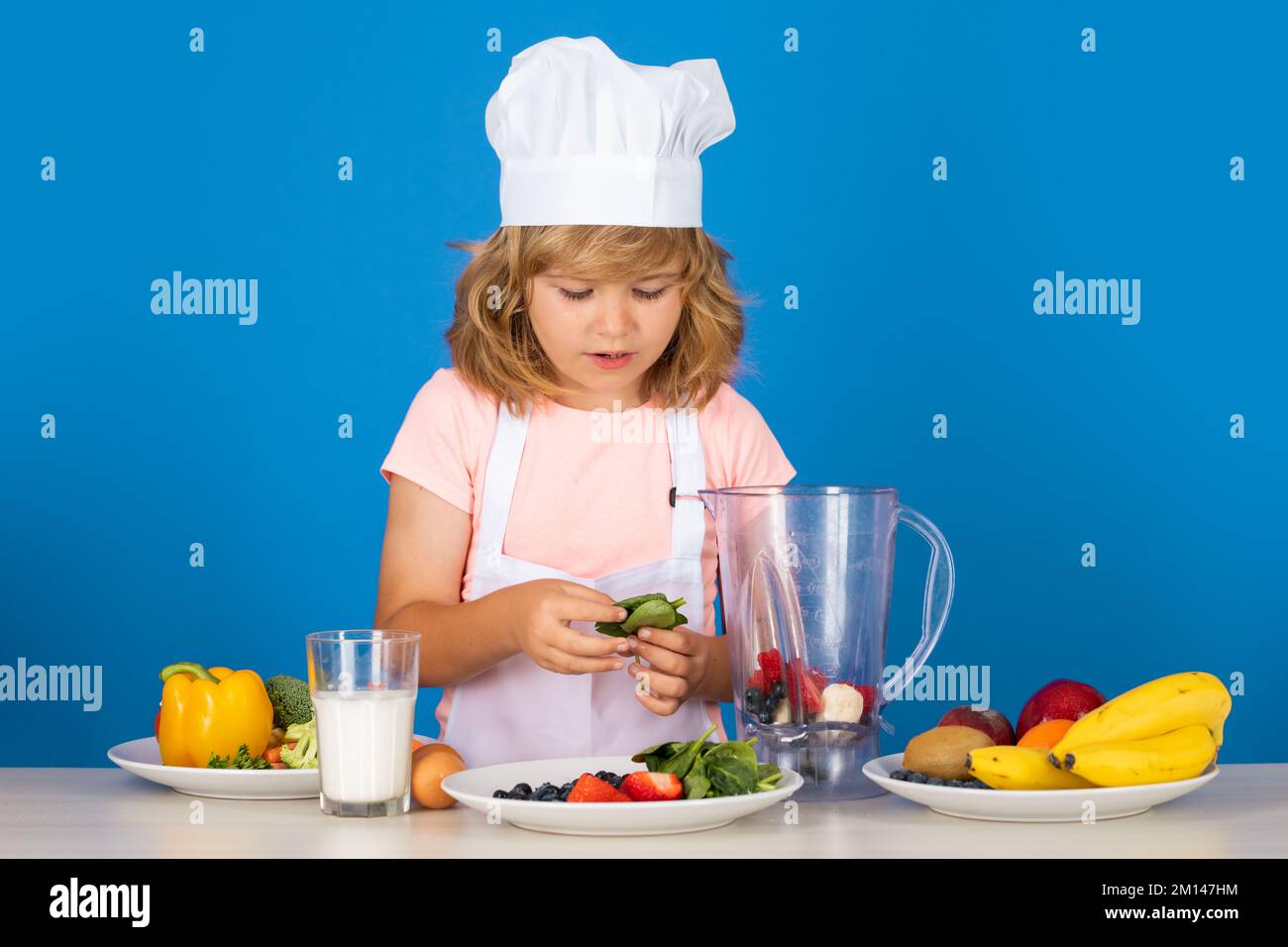 Portrait of chef child in cook hat. Cooking at home, kid boy preparing ...