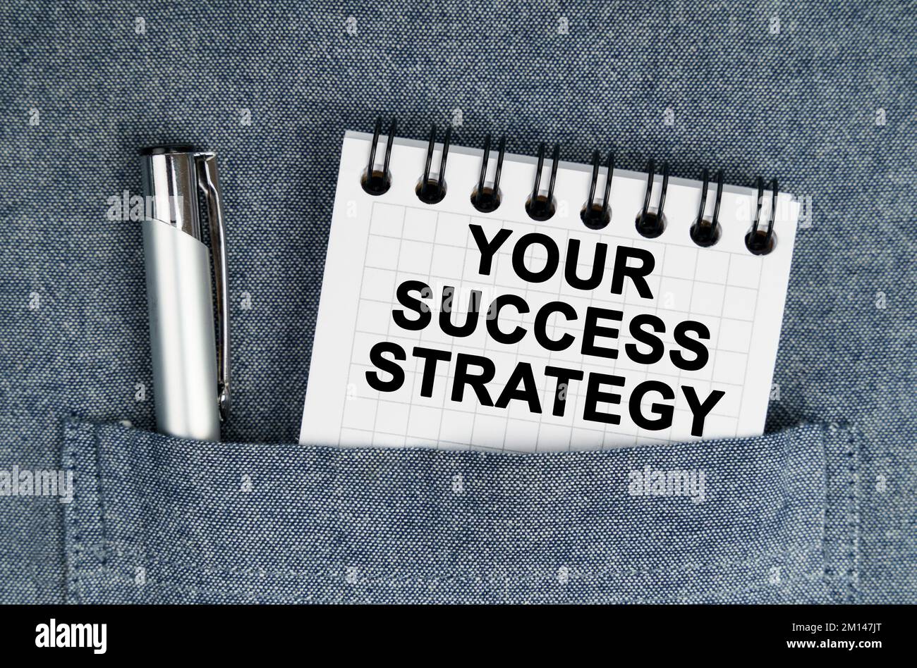 Business and finance concept. In my pocket is a pen and a notebook with ...