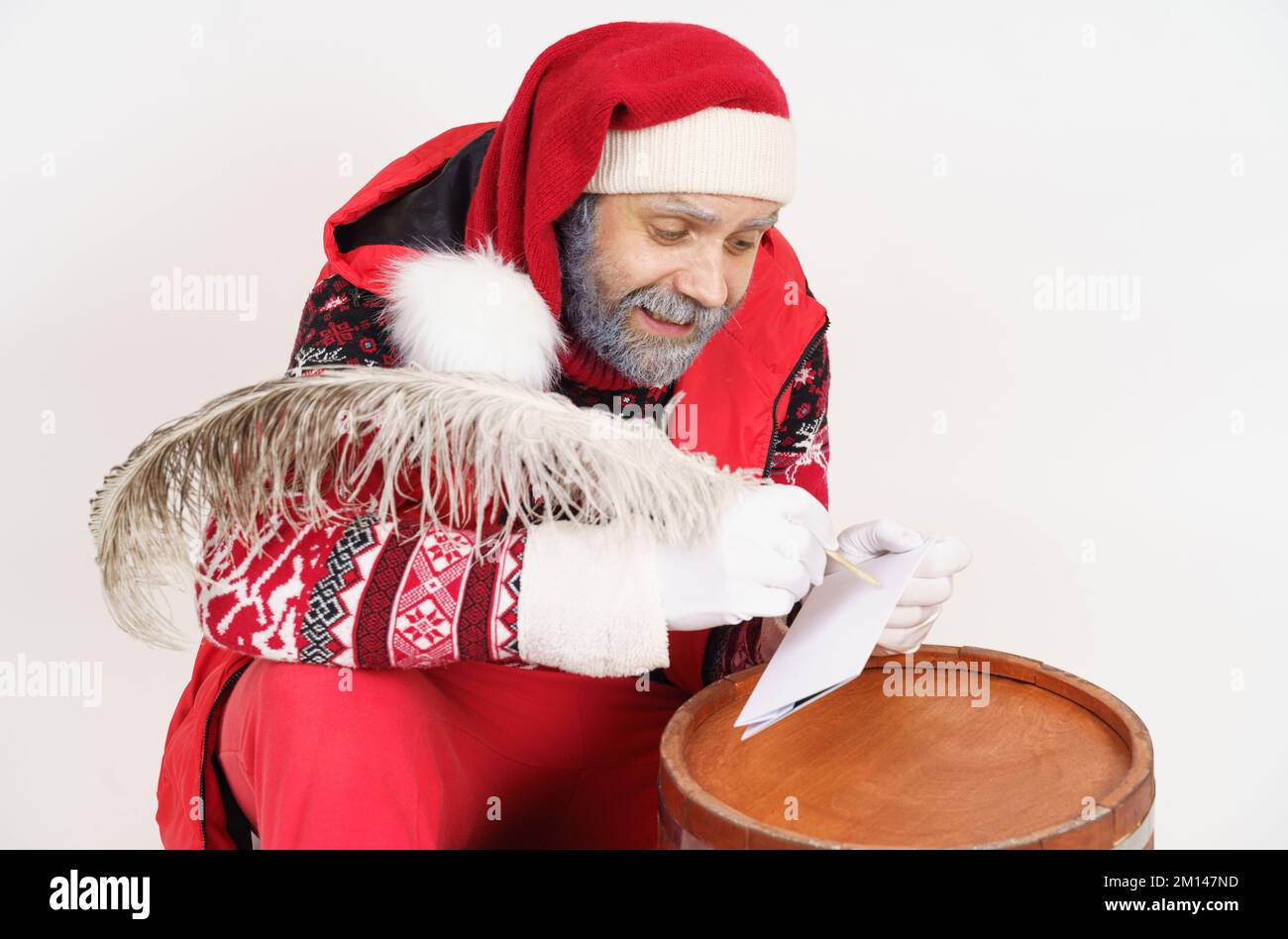 Holiday and Christmas concept. Santa Claus is sitting on the floor and ...