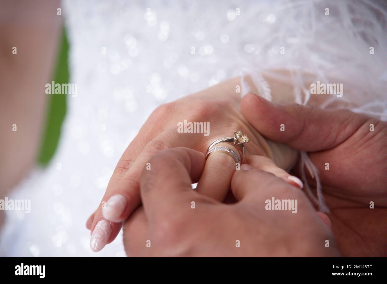 Putting wedding ring on brides hi-res stock photography and images - Alamy